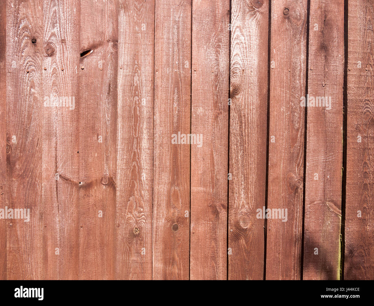 a clear and detailed texture of a wooden fence outside in sun light ...