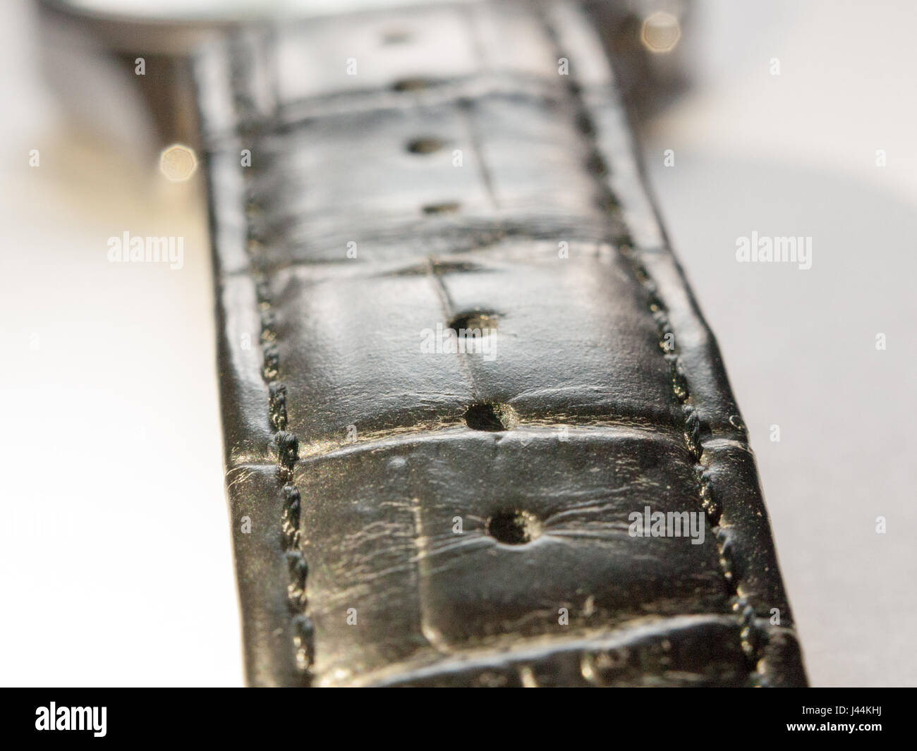 close up of black leather strap for watch on a white background macro ...