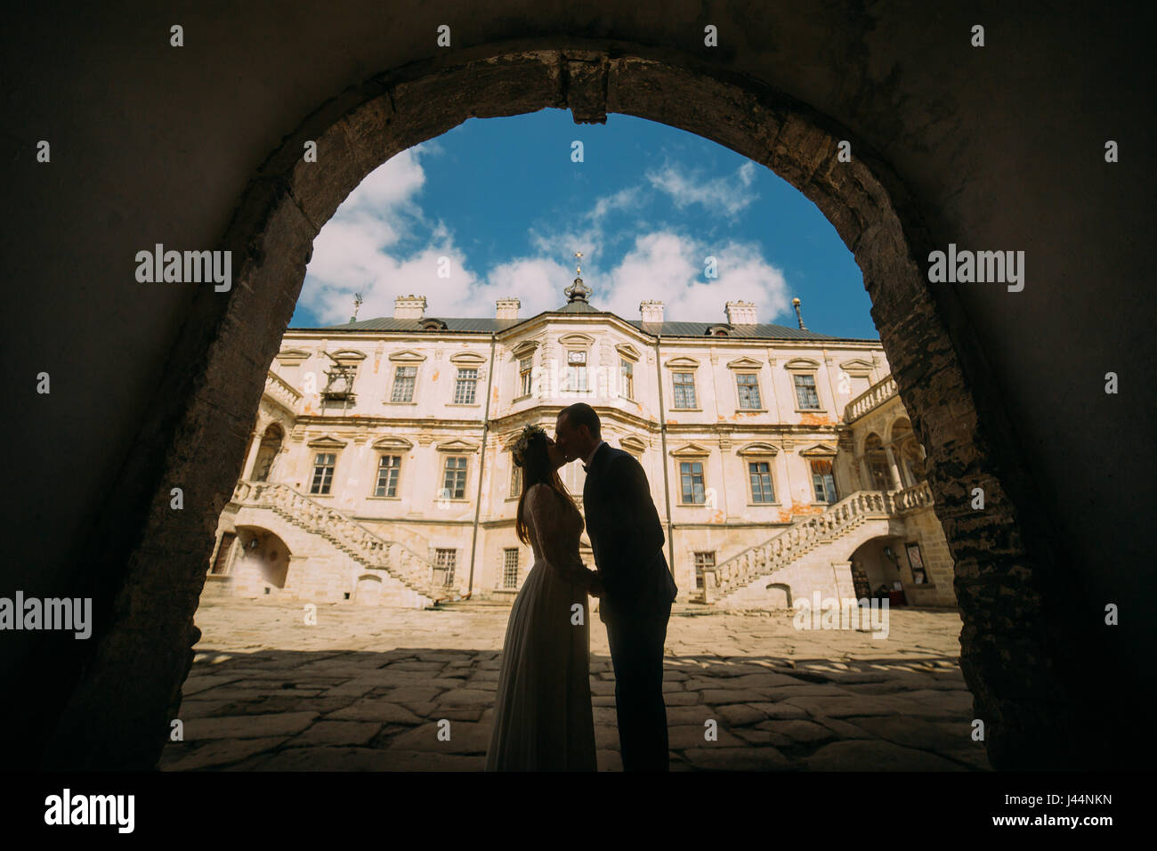 Passionate enloved couple share romantic at entrance arch of ...