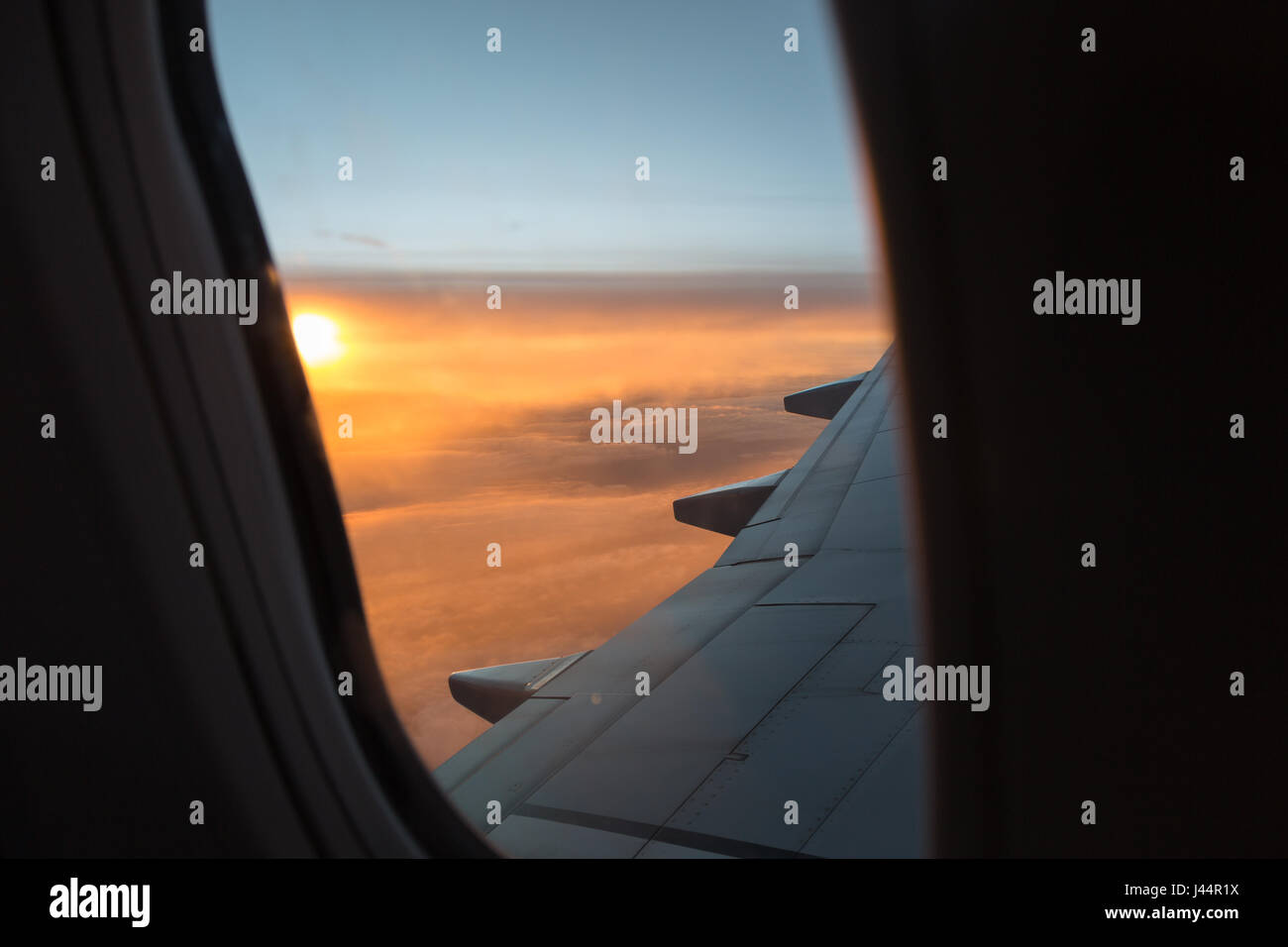 Looking Outside a Window of an Aircraft Cabin: White Airplane Wing and ...