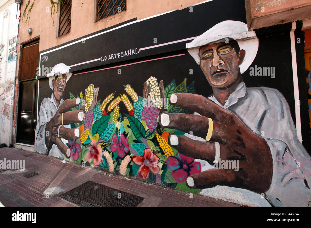 Street art mural of farmers with traditional crops, St Telmo ...