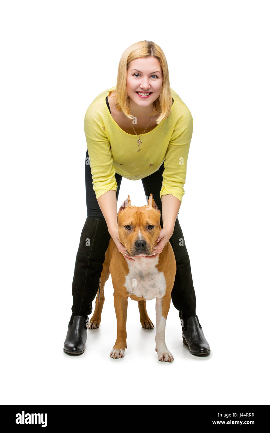Beautiful happy young woman hugging american staffordshire terrier dog ...
