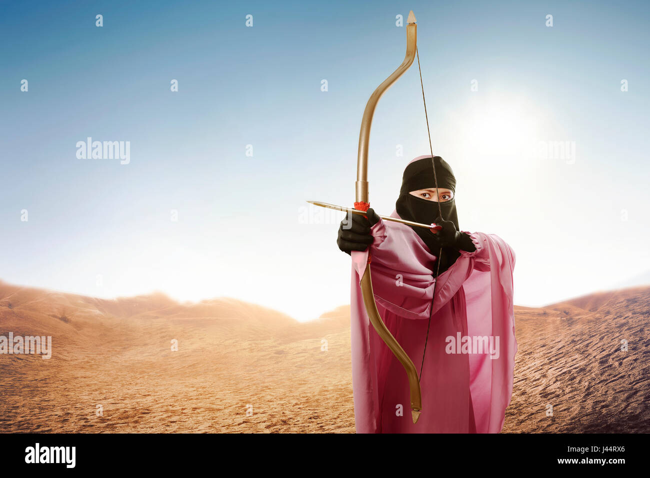 Beautiful woman aiming bow arrow hi-res stock photography and images ...