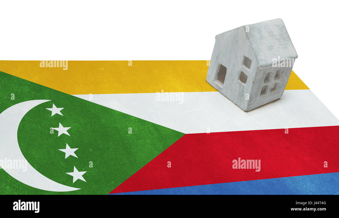 Small house on a flag - Living or migrating to Comoros Stock Photo - Alamy