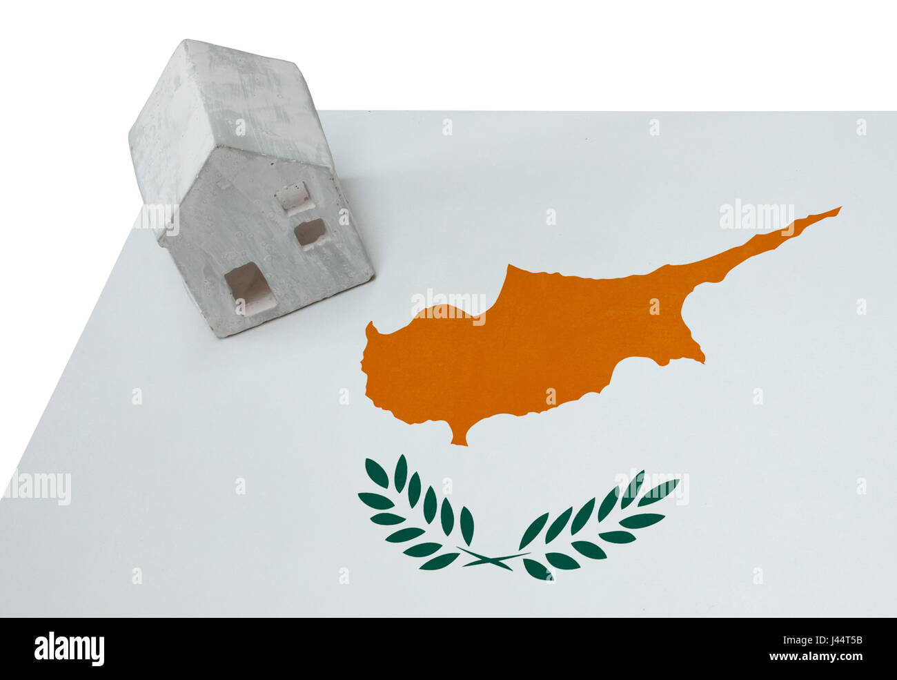 Small house on a flag - Living or migrating to Cyprus Stock Photo - Alamy