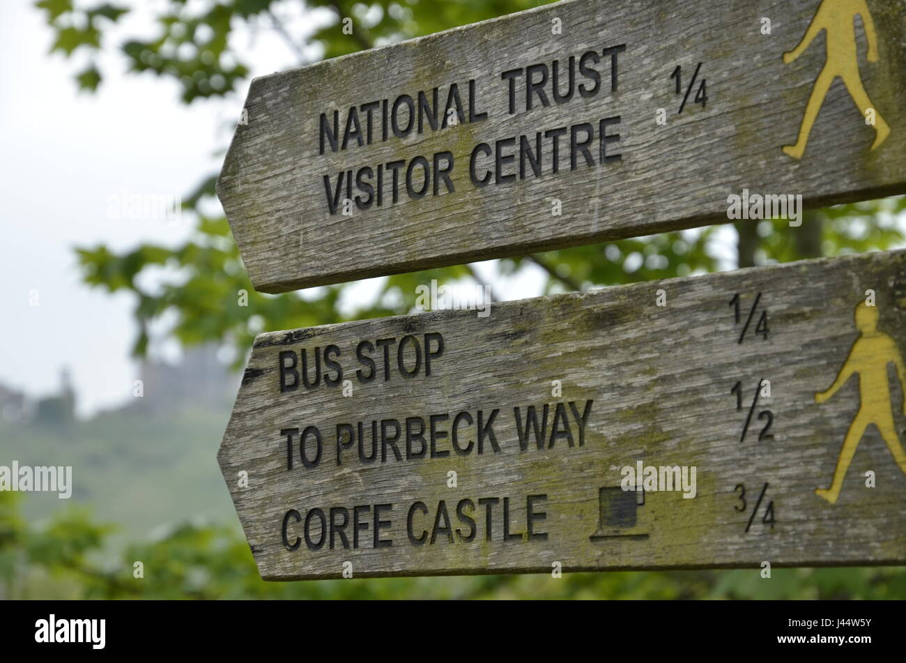 A footpath sign on the Purbeck Way at Corfe Castle in Dorset Stock ...