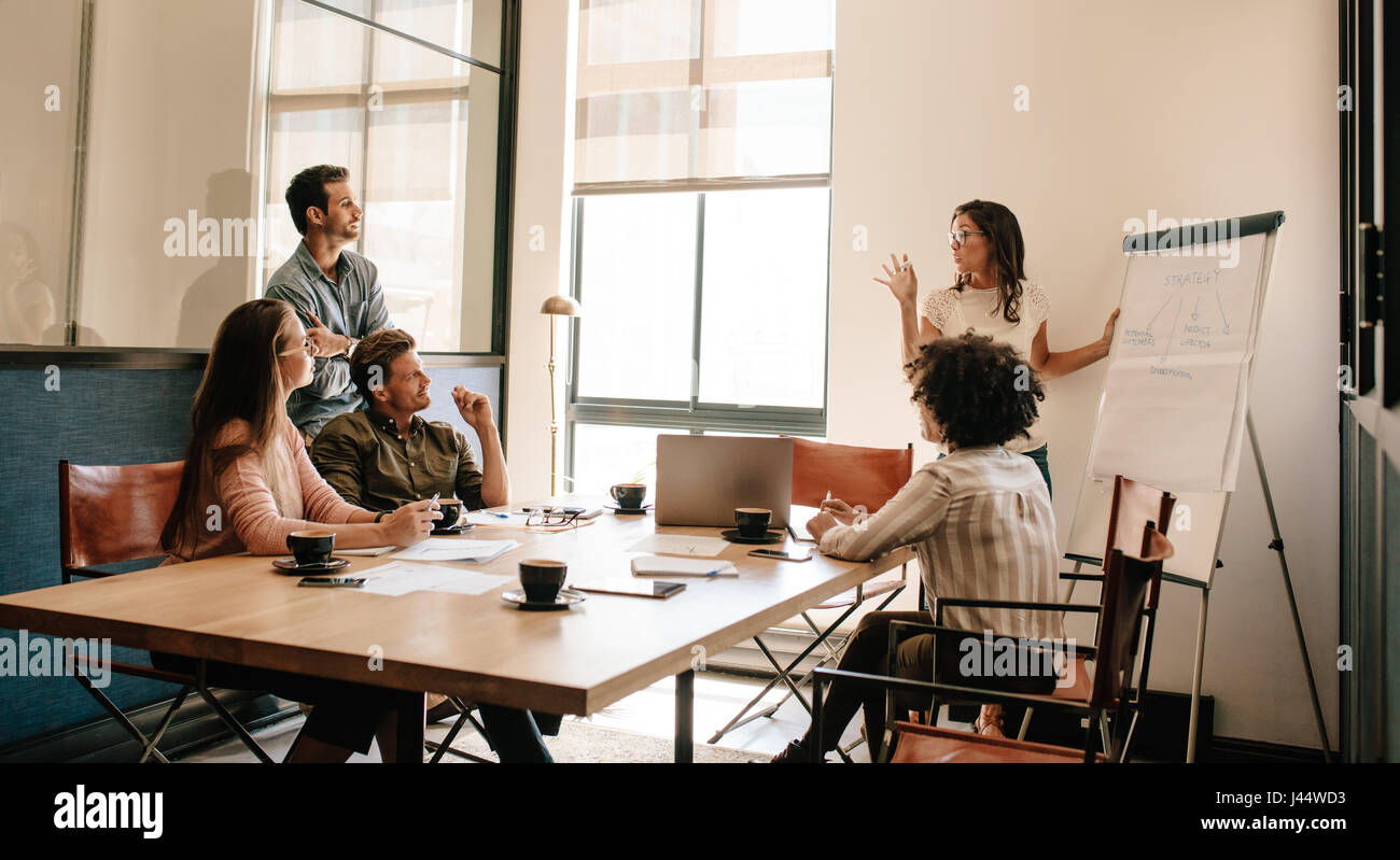 Creative business team having new project discussion in conference room ...