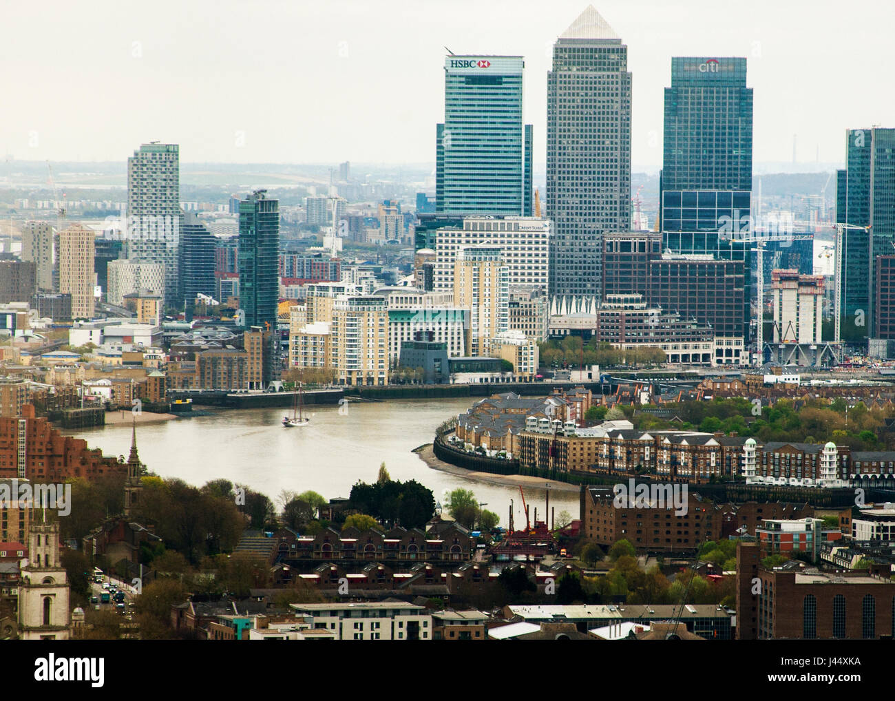 Ship sailing down the River Thames in Greenwich with canary wharf ...