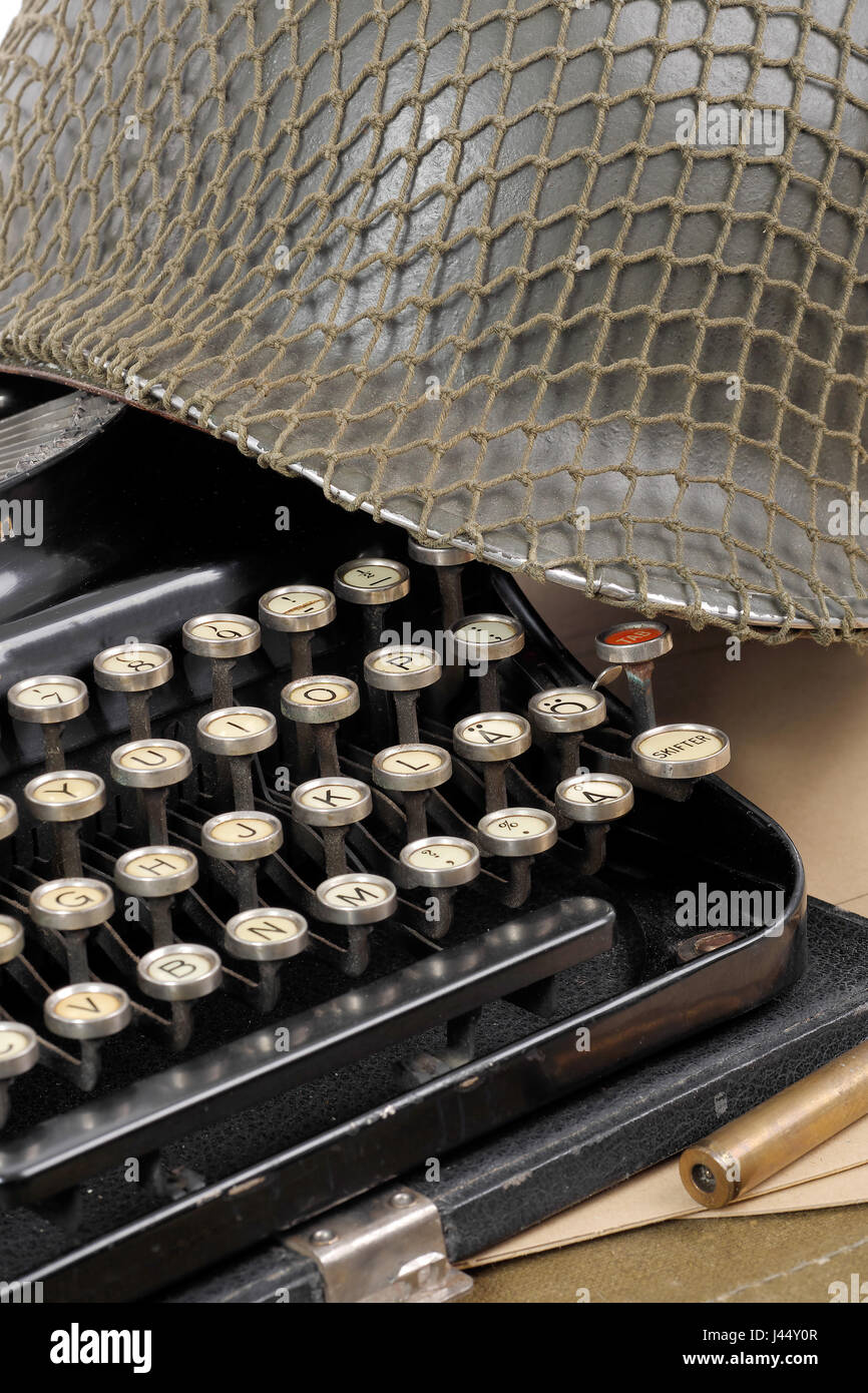 the US military helmet of the Second World War with old typewriter ...