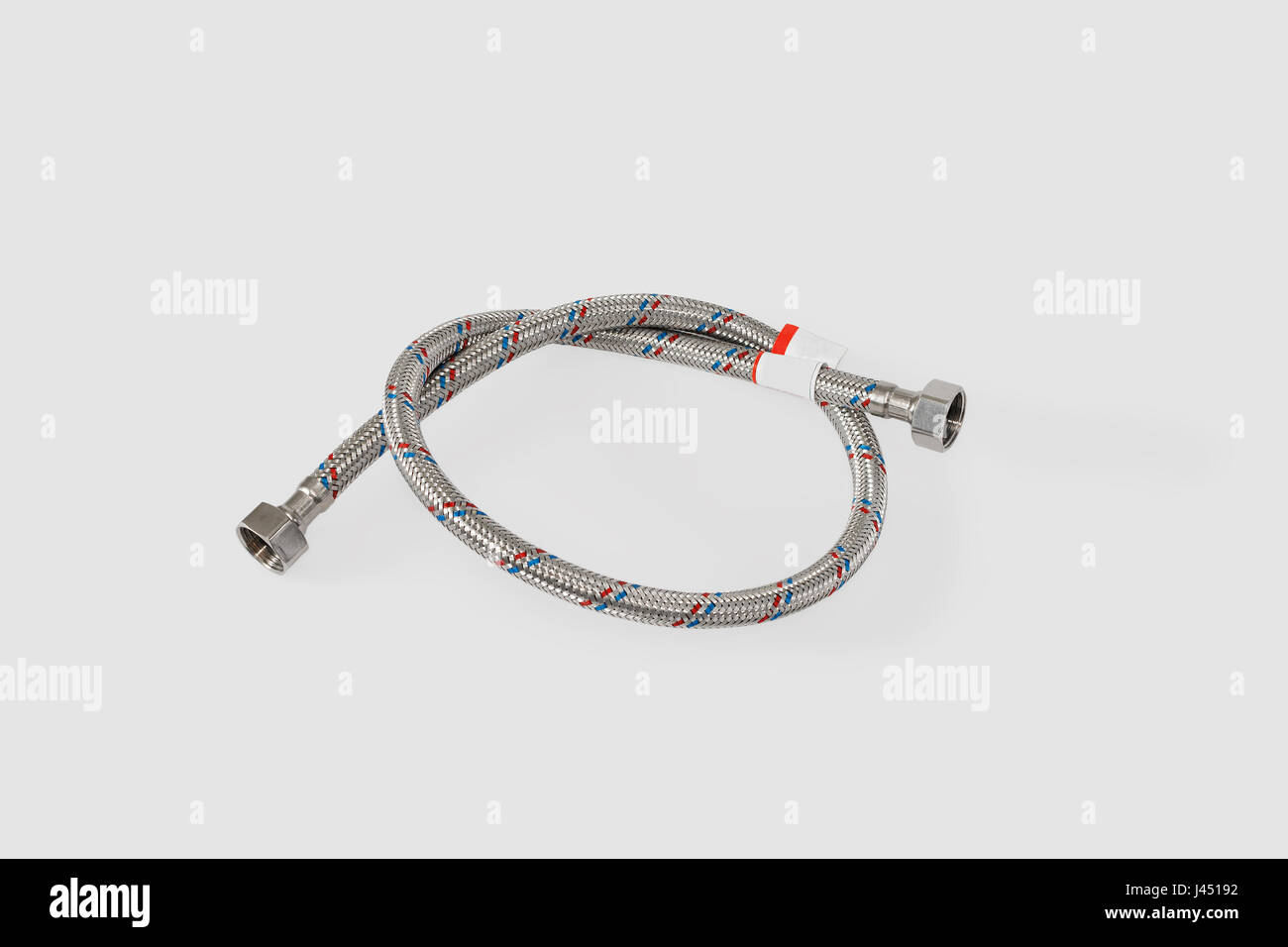 Hose braided in a braid. Isolated on a gray background Stock Photo - Alamy