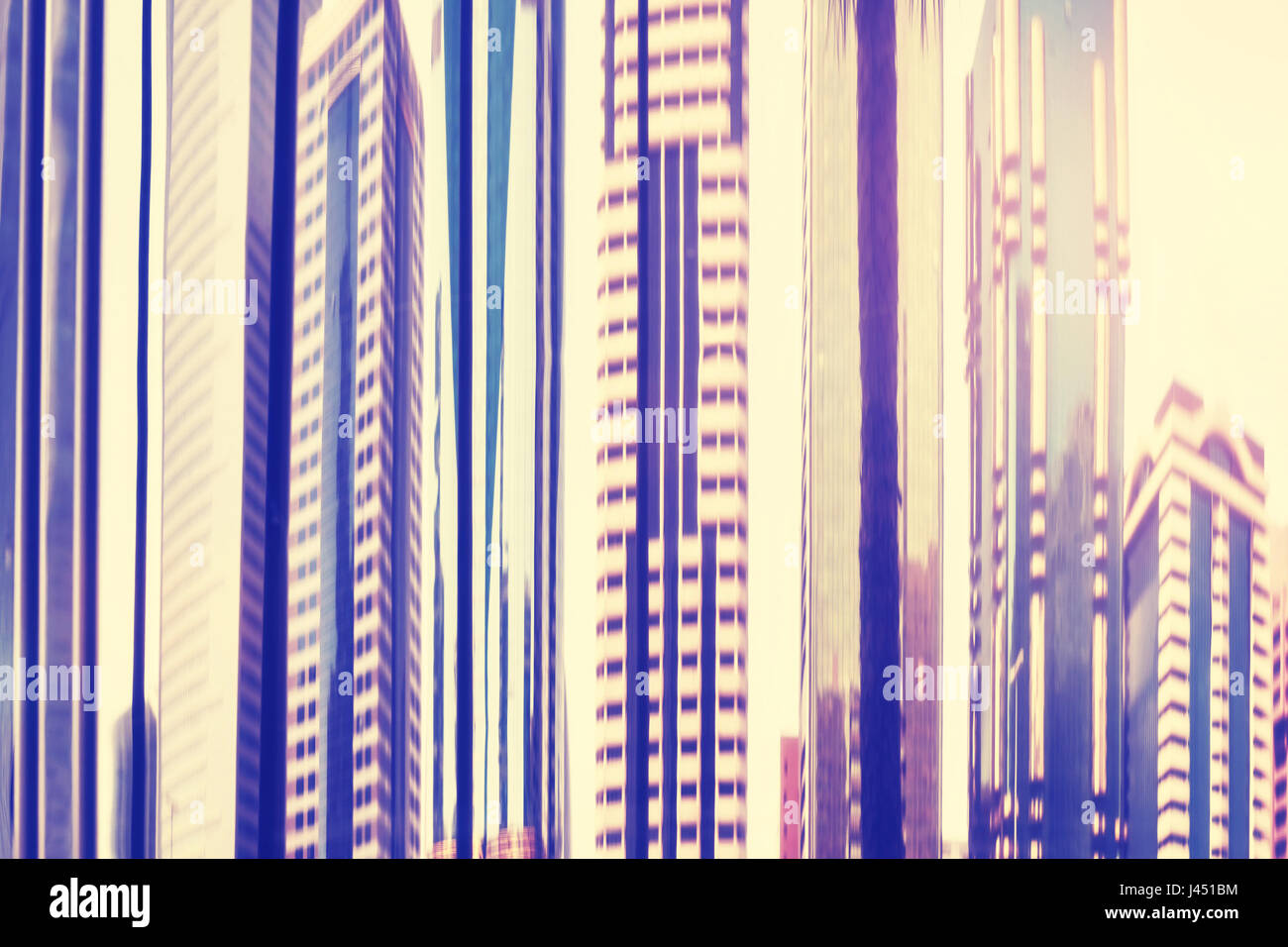 Modern buildings distorted and blurred view reflected in a cylindrical ...