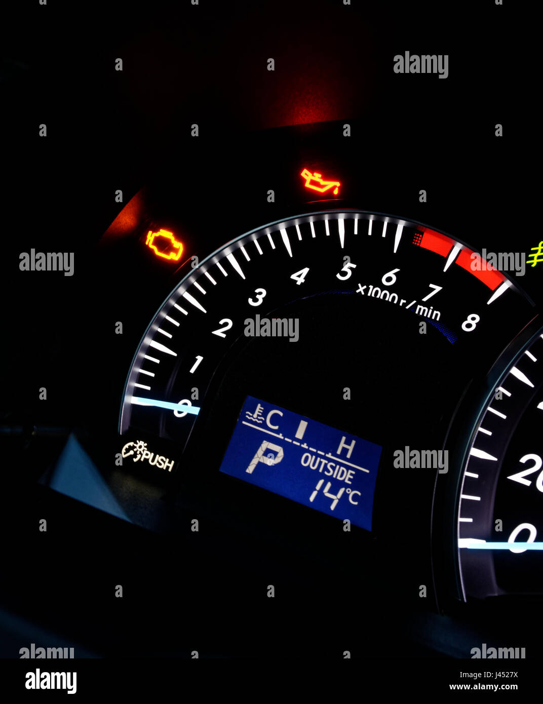 Closeup photo of modern car tachometer on black background, night state ...