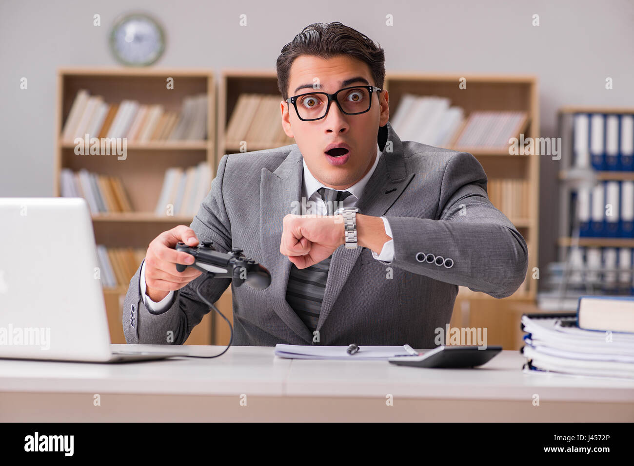 Businessman playing computer games at work office Stock Photo - Alamy