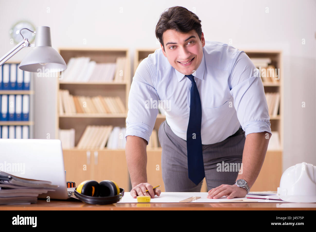 Engineer supervisor working on drawings in the office Stock Photo - Alamy