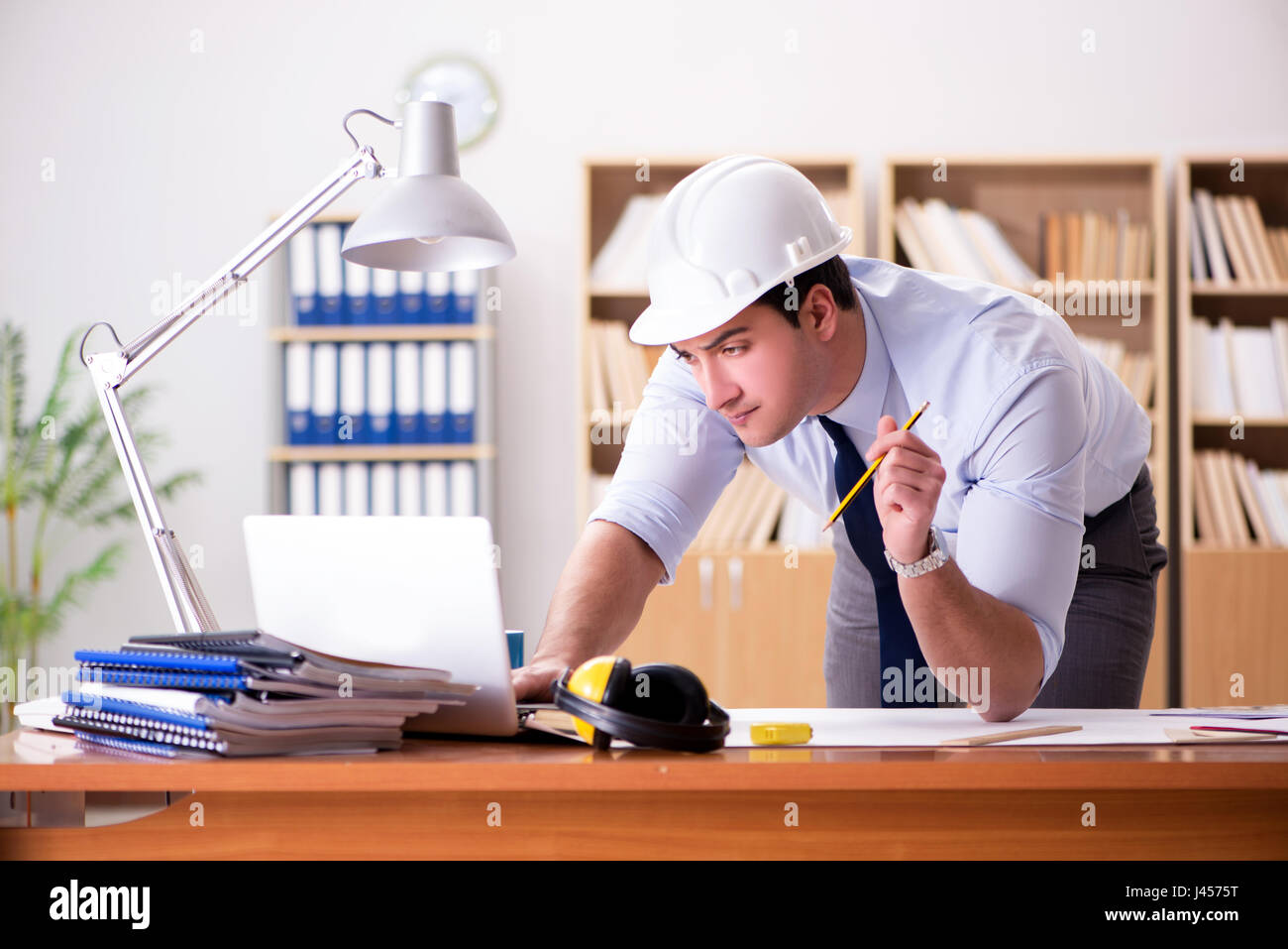 Engineer supervisor working on drawings in the office Stock Photo - Alamy