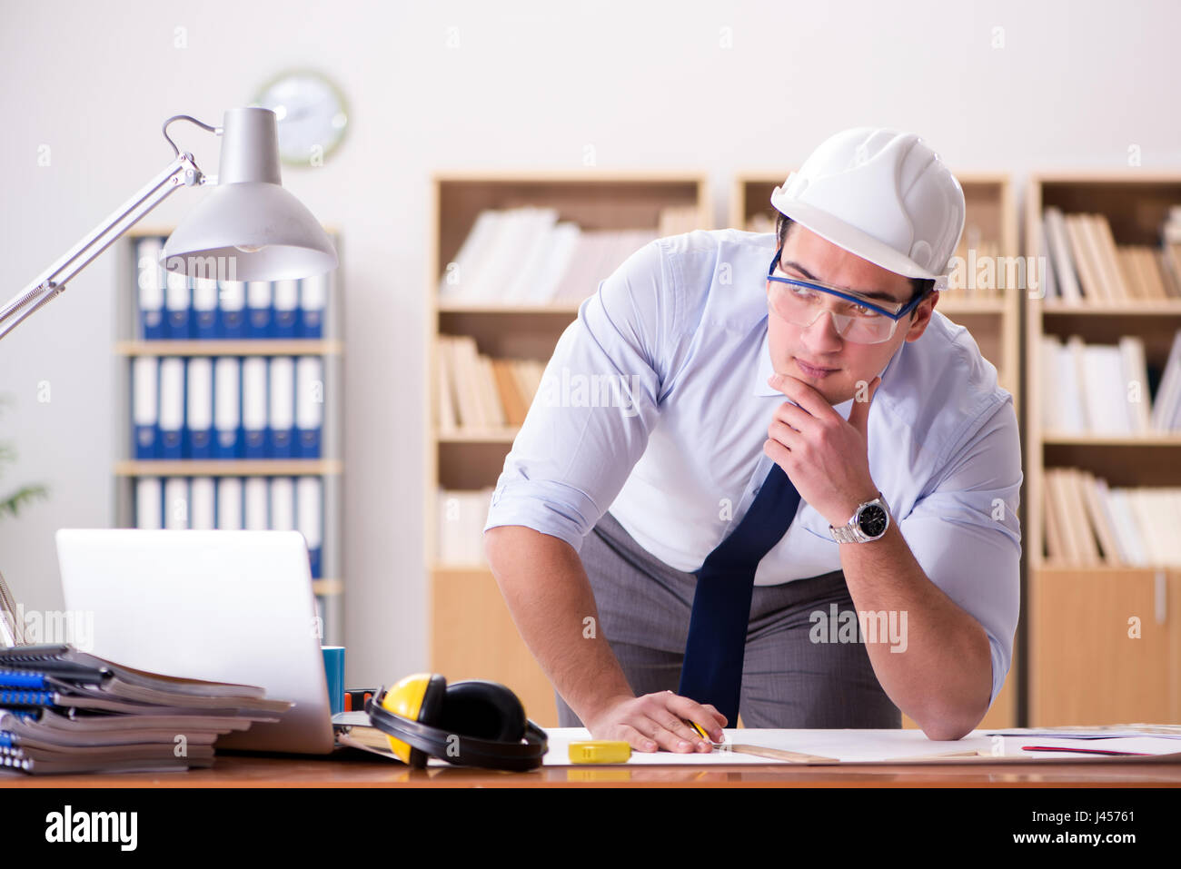 Engineer supervisor working on drawings in the office Stock Photo - Alamy
