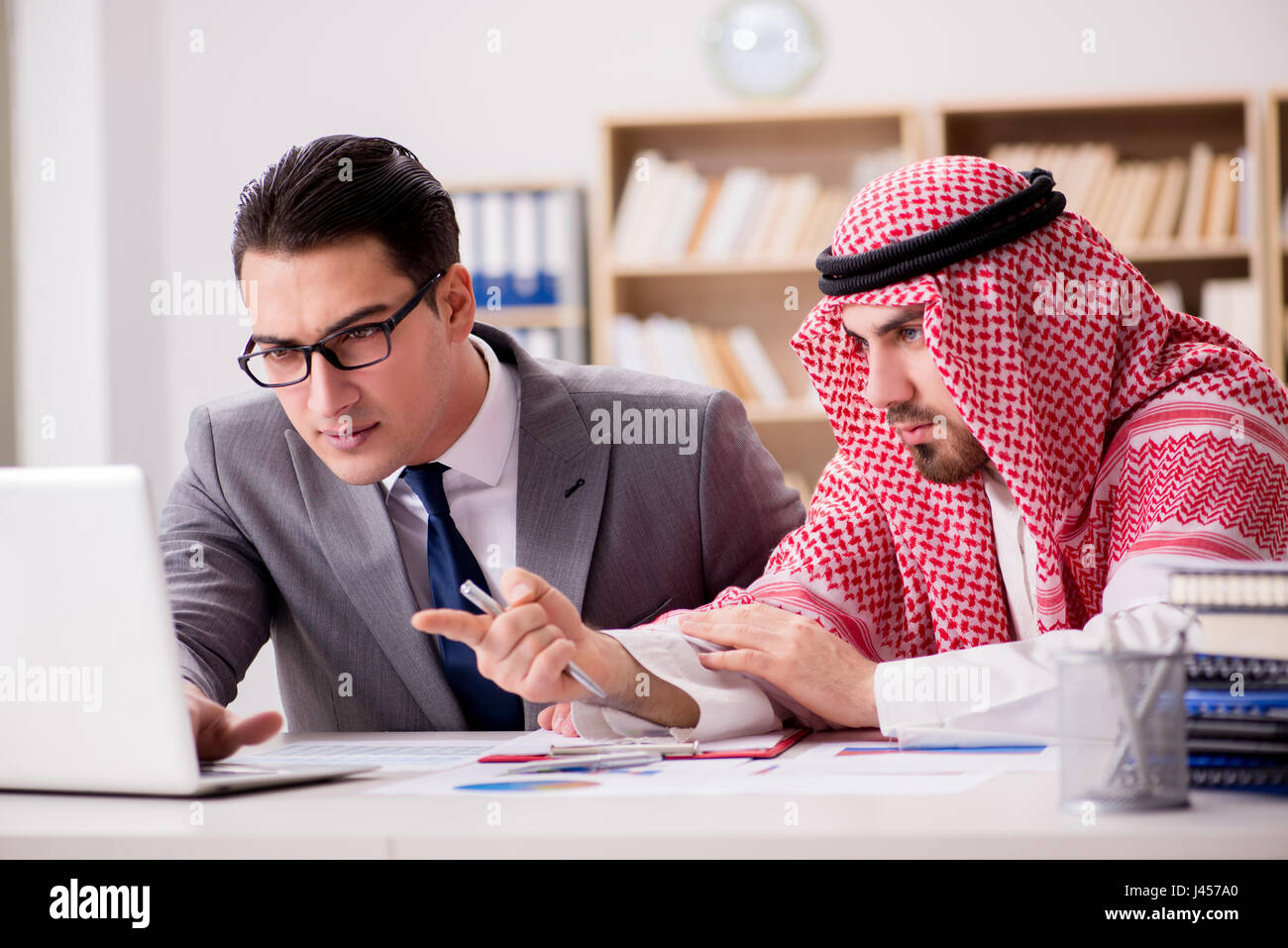 Diverse business concept with arab businessman Stock Photo - Alamy