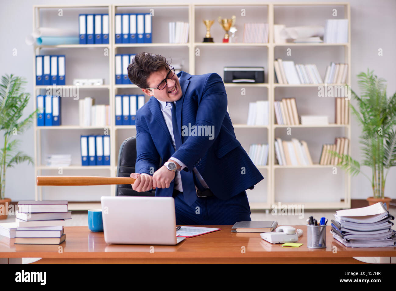 Angry aggressive businessman in the office Stock Photo - Alamy