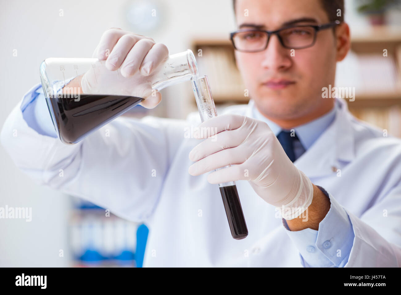 Chemical engineer working on oil samples in lab Stock Photo - Alamy