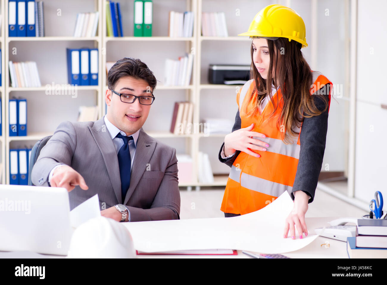 Construction foreman supervisor reviewing drawings Stock Photo - Alamy