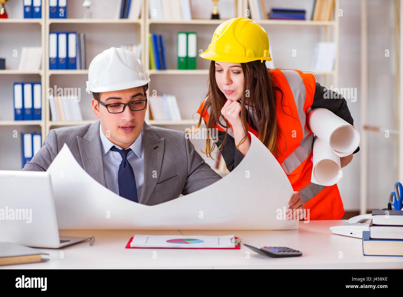 Construction foreman supervisor reviewing drawings Stock Photo - Alamy