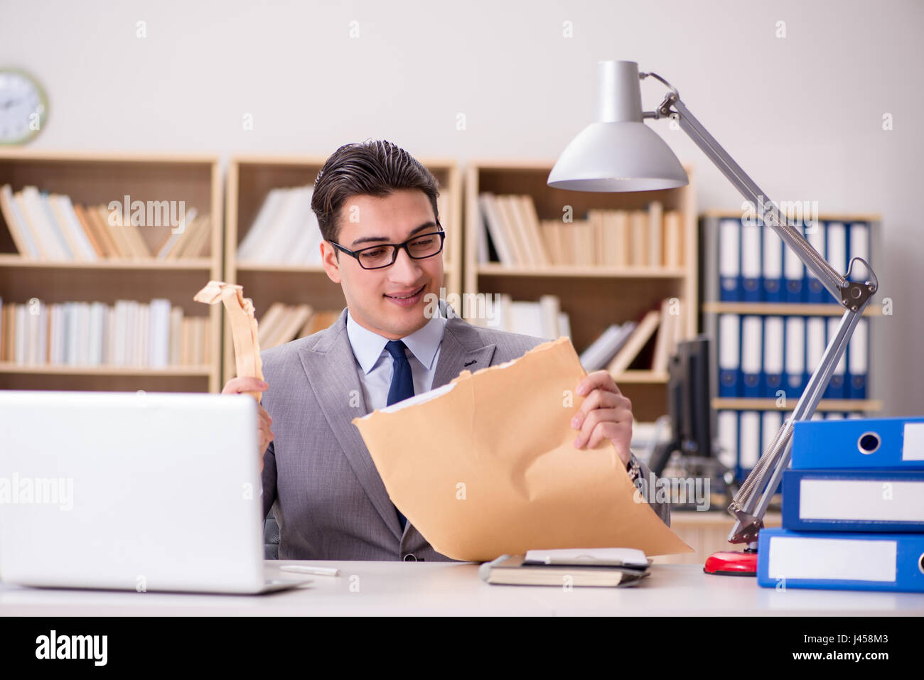 Businessman receiving letter in the office Stock Photo - Alamy