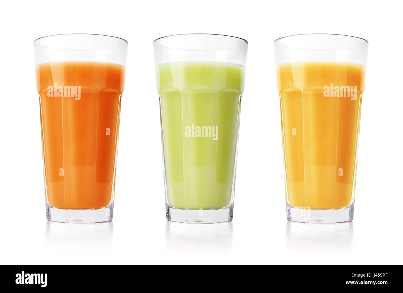 Green, orange and yellow smoothies in glasses isolated on white ...