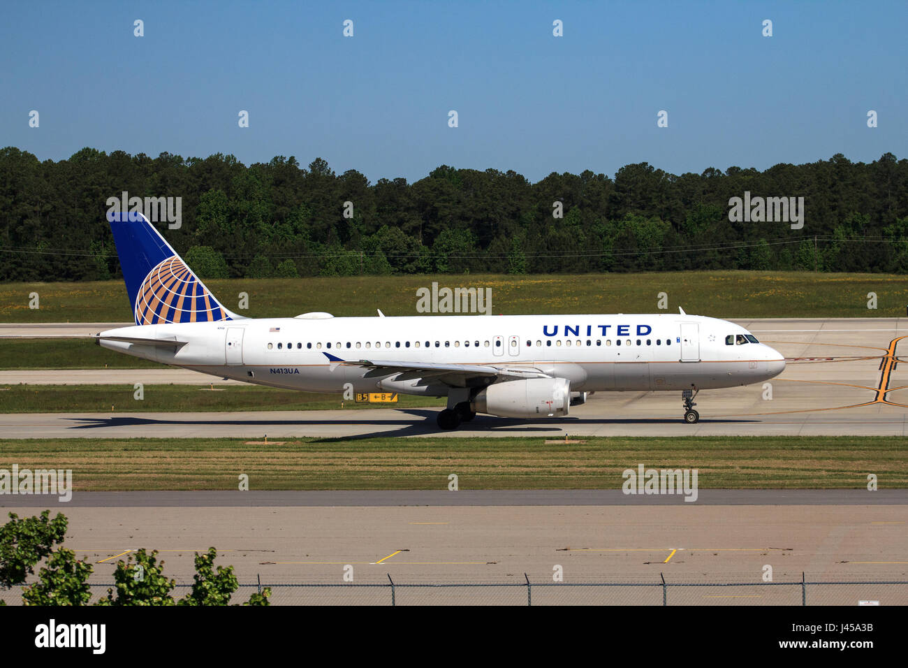 United Airplane on runway at RDU international airport Stock Photo - Alamy