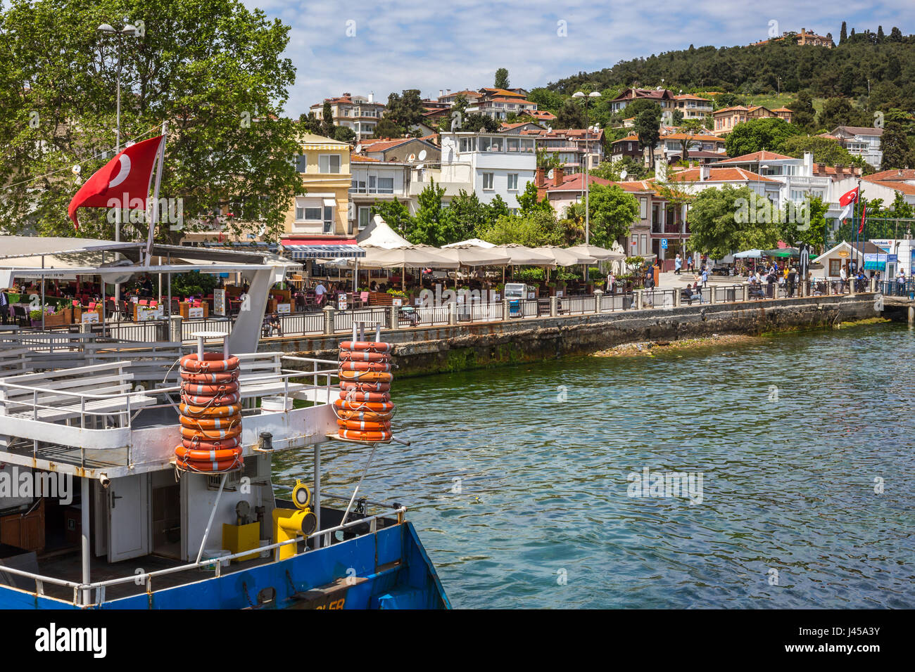 Coastal view of restaurants and the ferry boat, Turkey, photographed at ...