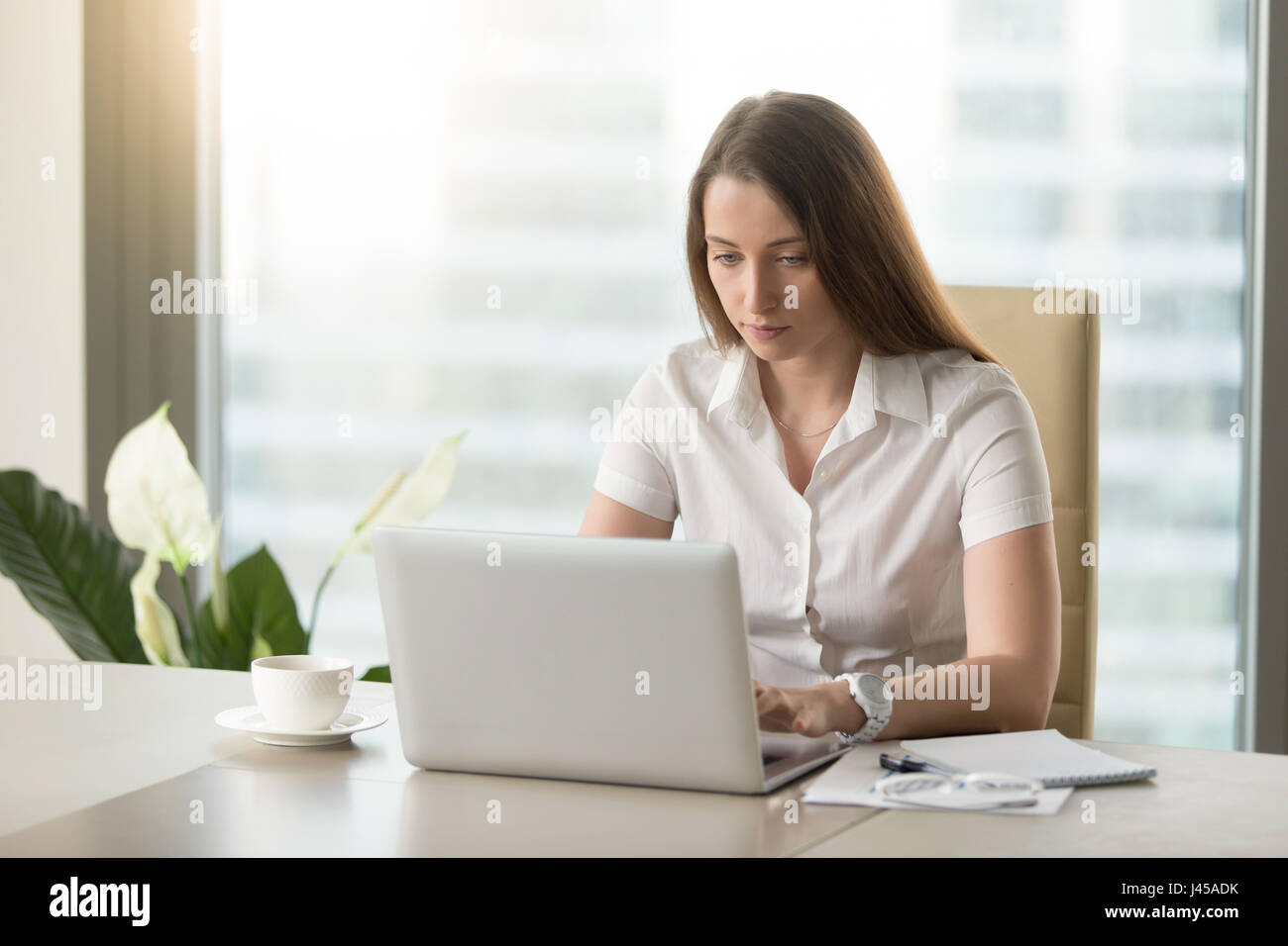 Female office worker doing everyday work routine Stock Photo - Alamy