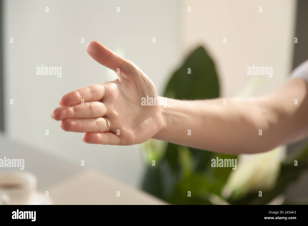 Image of reached out for handshake womans hand Stock Photo - Alamy