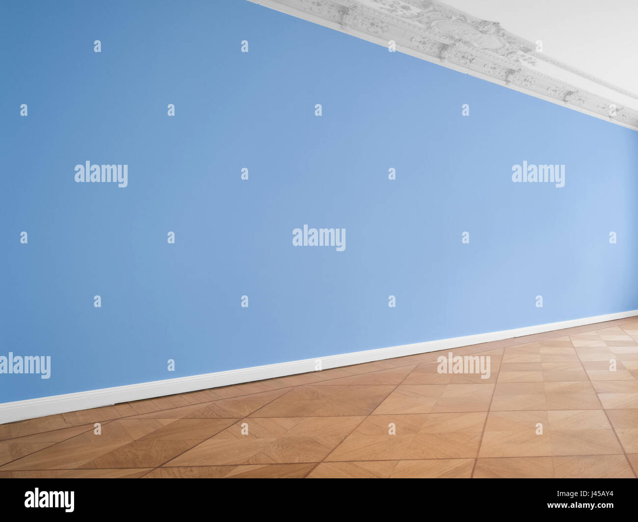 blue wall background in empty room with wooden floor Stock Photo - Alamy