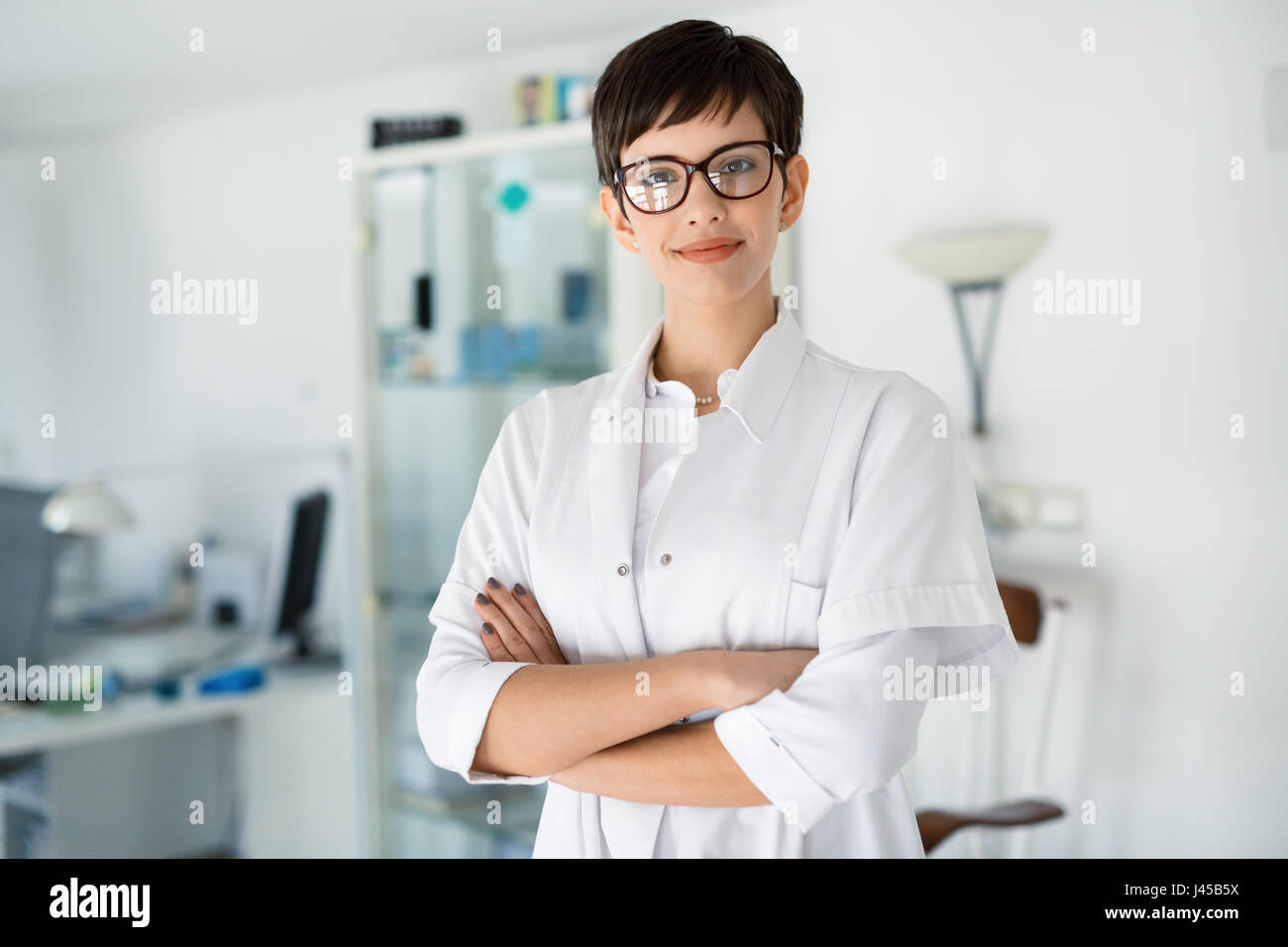 Portrait of female optometrist at eyesight medical ophthalmology clinic ...