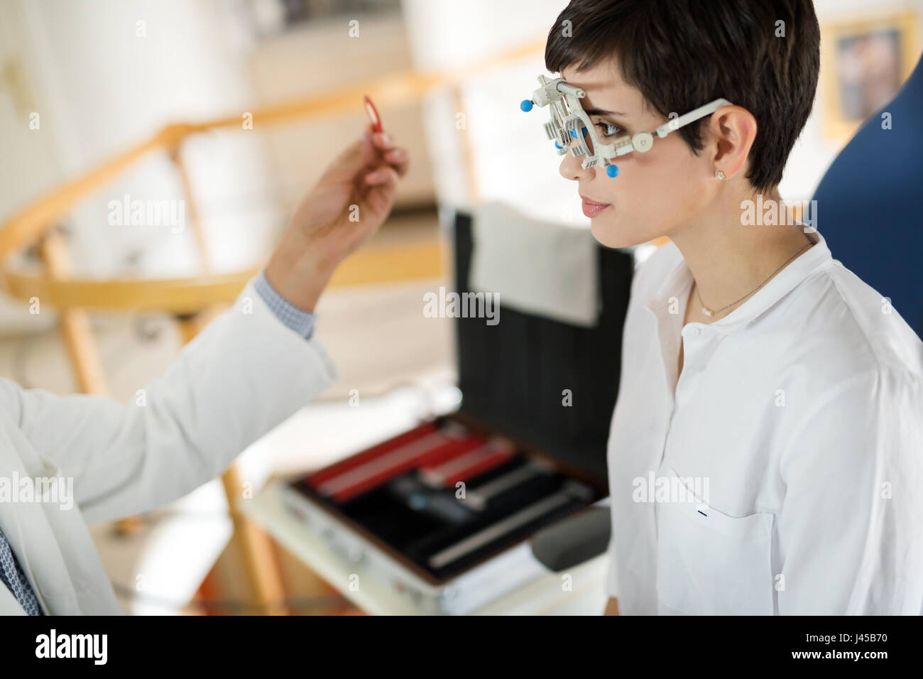 Female patient in ophthalmology clinic for diopter detection Stock ...