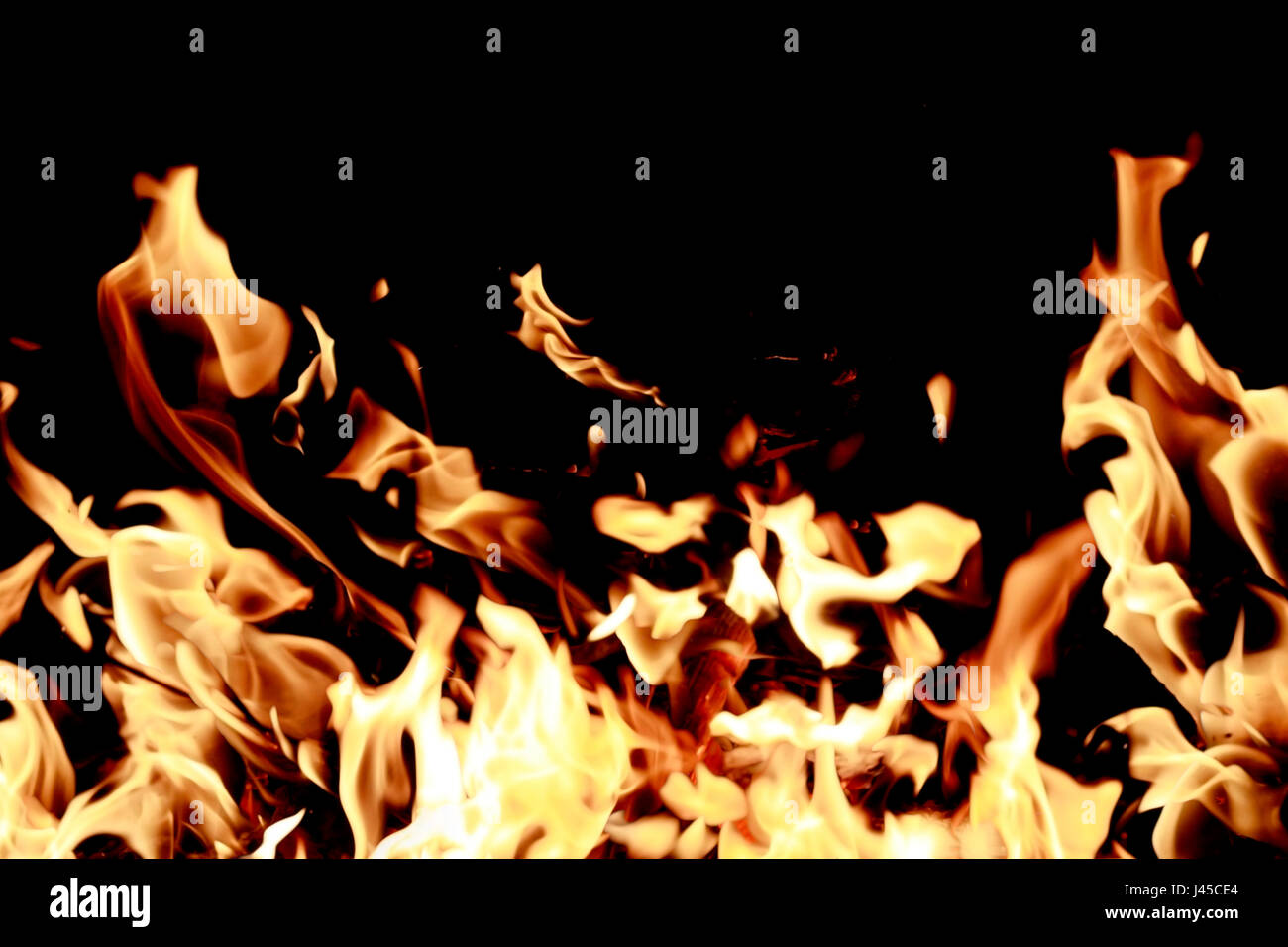 Intense fire isolated over black background Stock Photo - Alamy