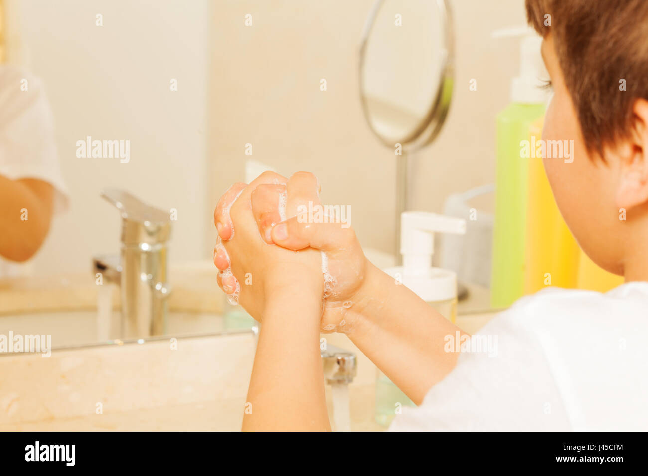 Boy learning to wash hands hi-res stock photography and images - Alamy