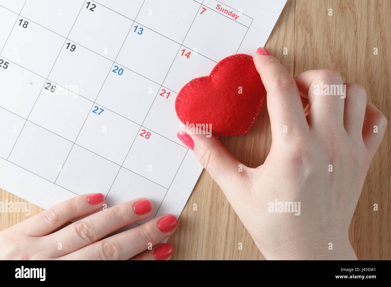 Red heart and calendar, love month Stock Photo - Alamy