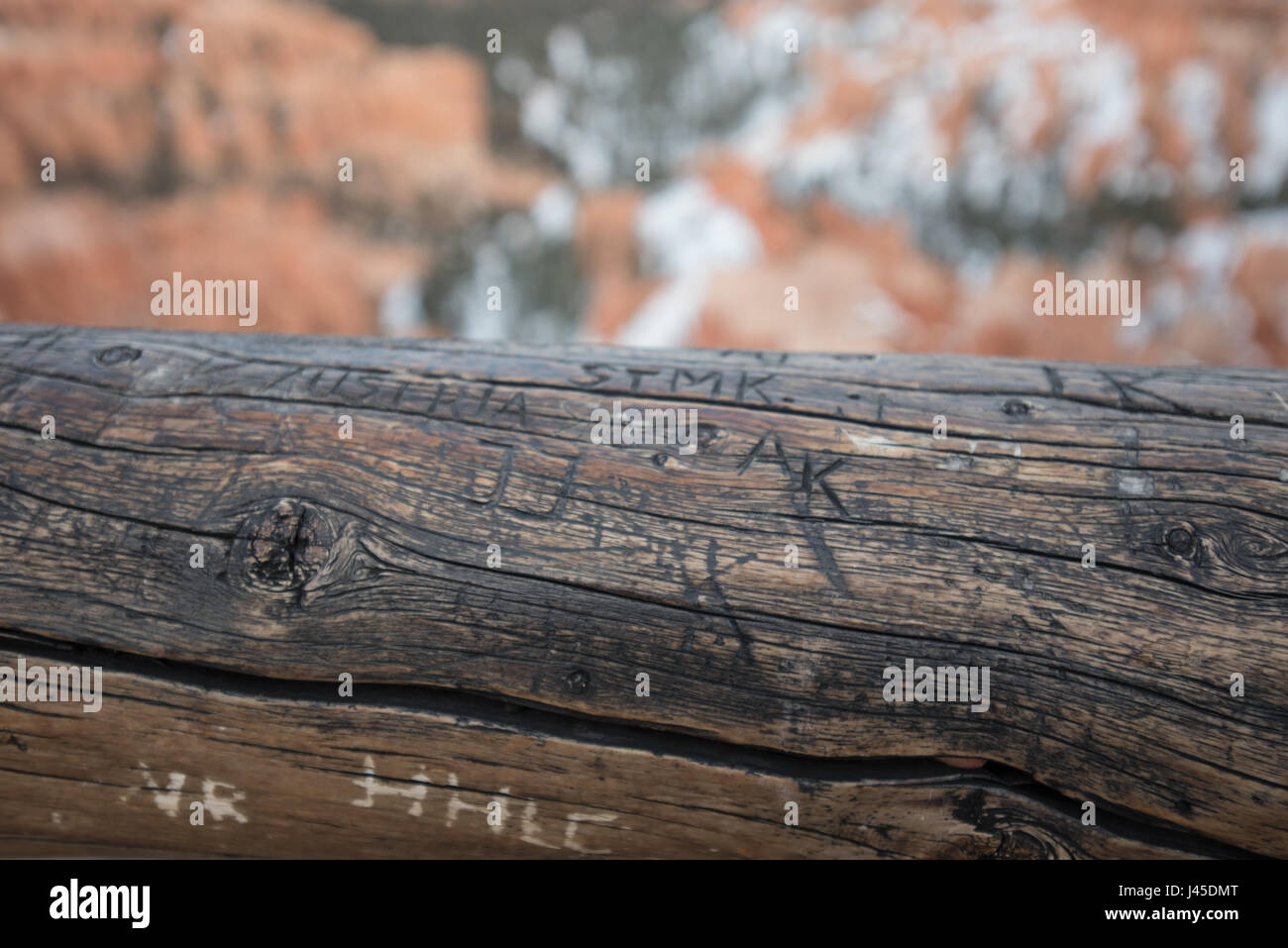 Graffiti on Worn Log Hand Rail Stock Photo - Alamy