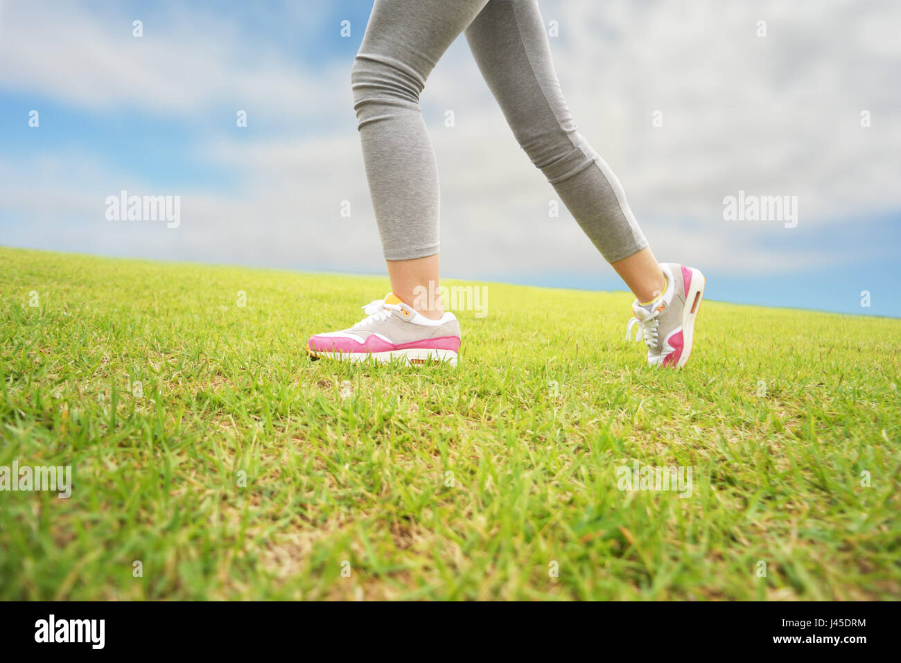 Side view of a girl running legs and feet Stock Photo - Alamy