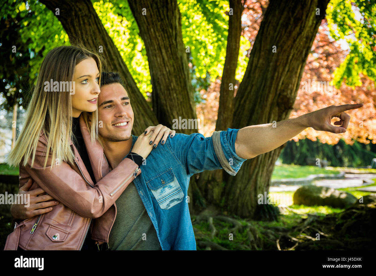 Boyfriend and girlfriend standing showing romantic love Stock Photo - Alamy