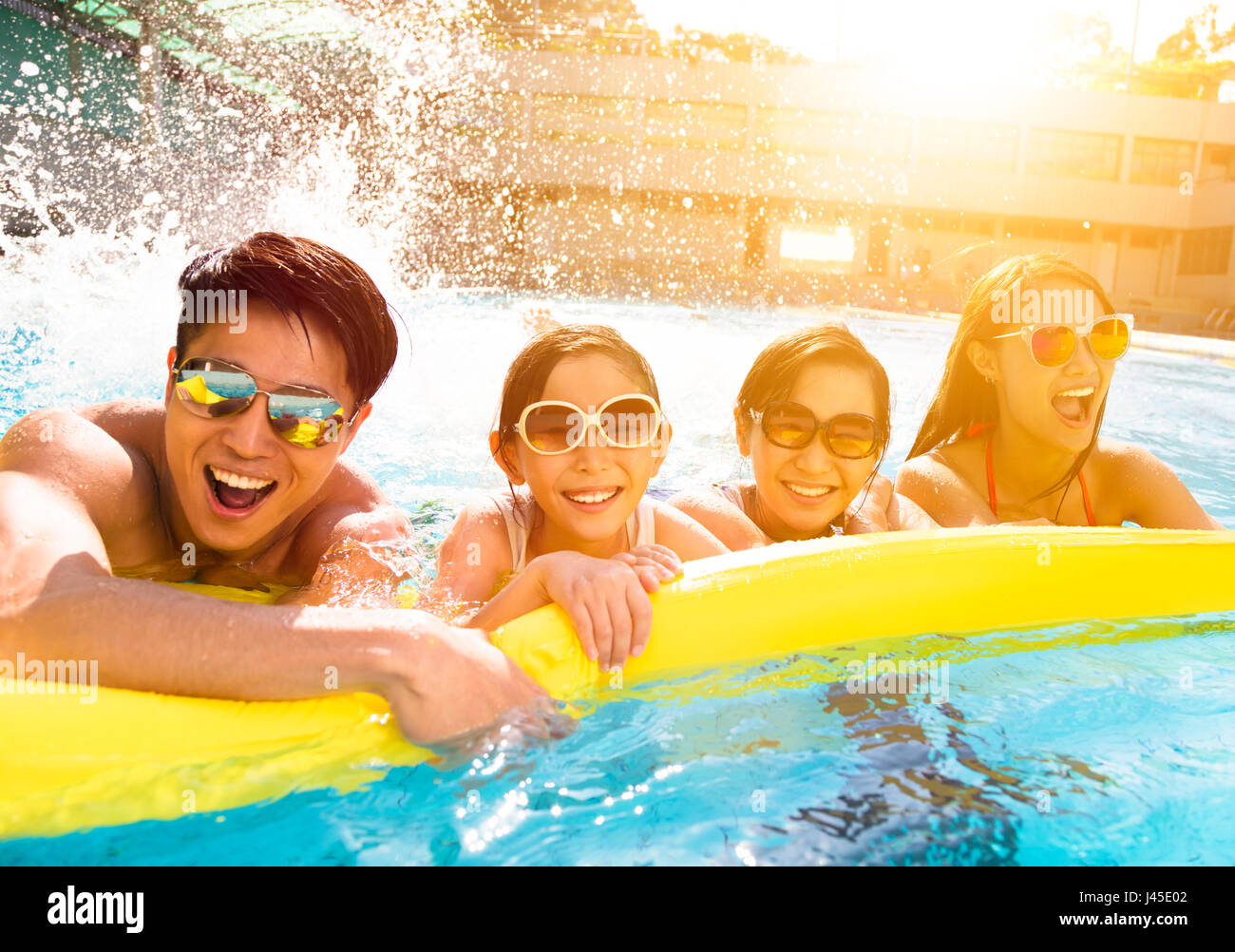Family portrait in pool hi-res stock photography and images - Alamy