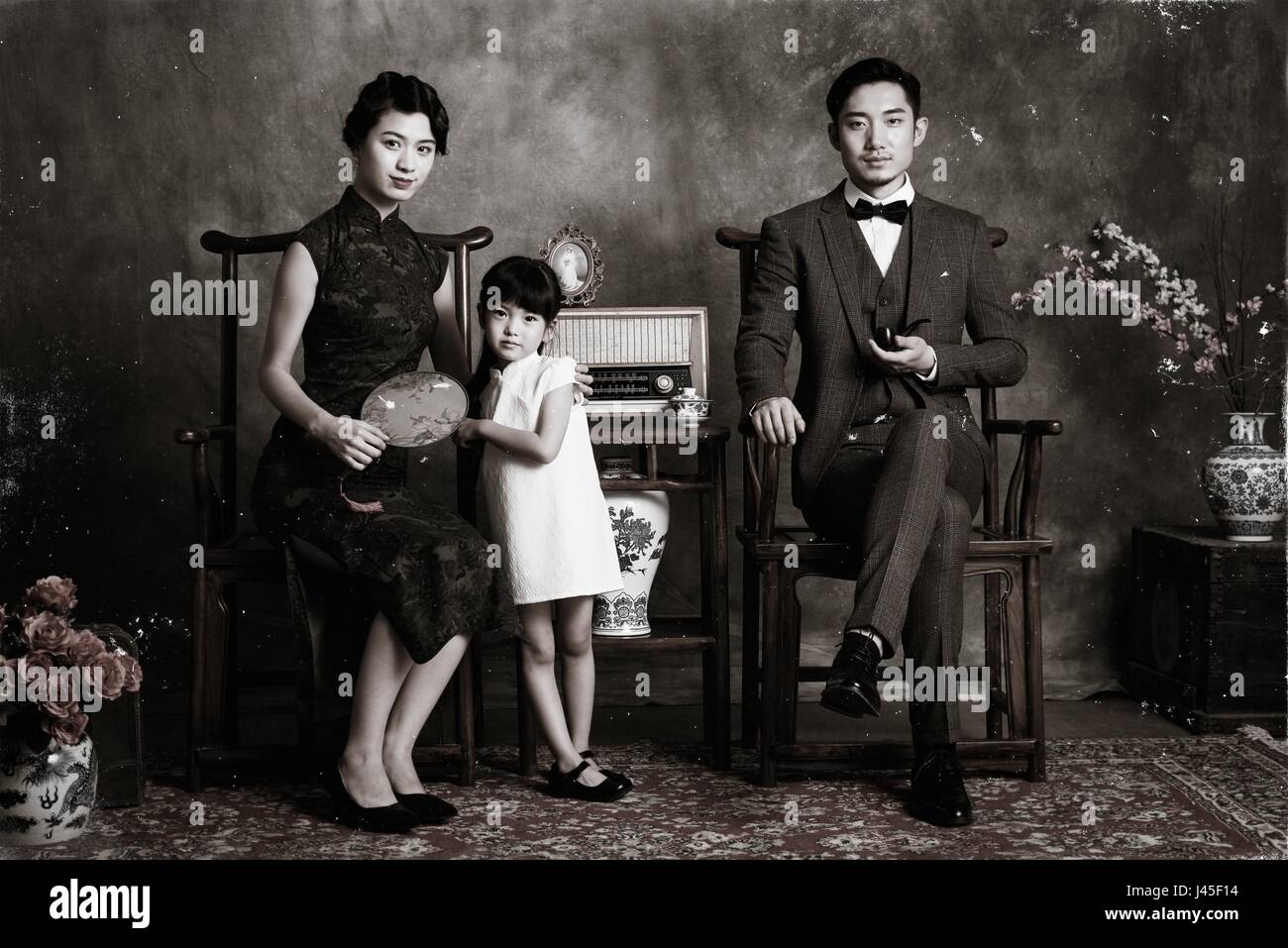 Classical style of a family of three photo Stock Photo - Alamy