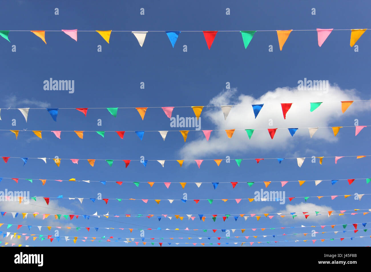 colorful triangle flag with beautiful sky background Stock Photo - Alamy