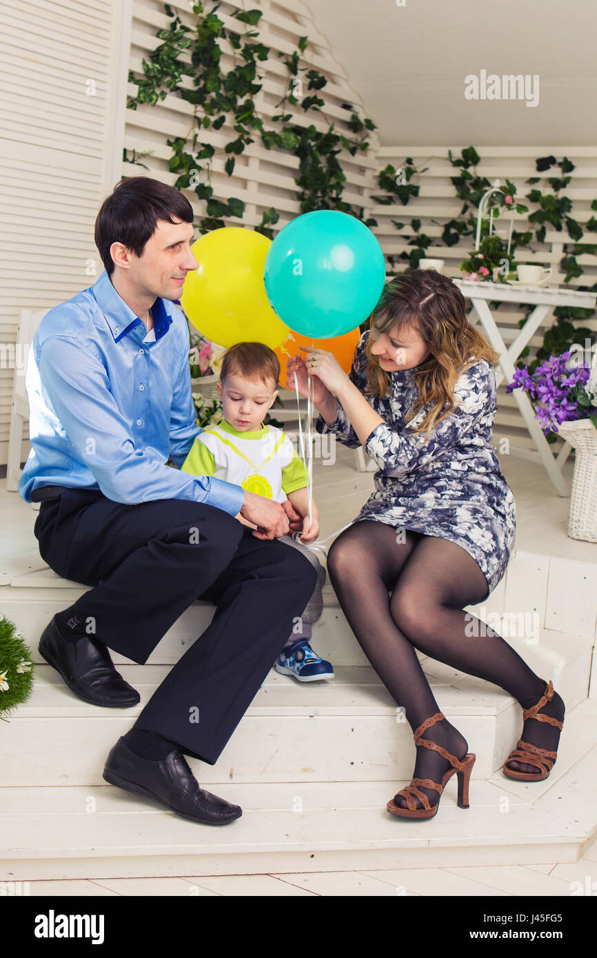 kid with parents celebrating birthday Stock Photo - Alamy