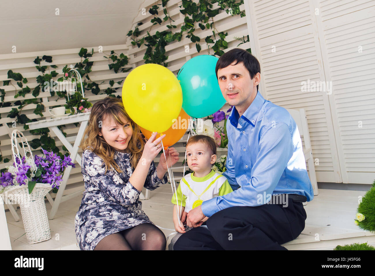 kid with parents celebrating birthday Stock Photo - Alamy