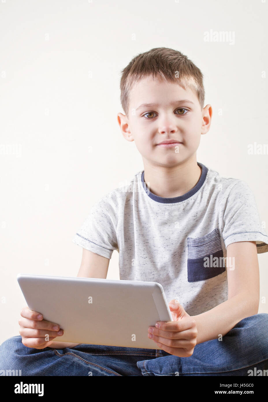 Little boy with tablet computer. Childhood, education, learning ...