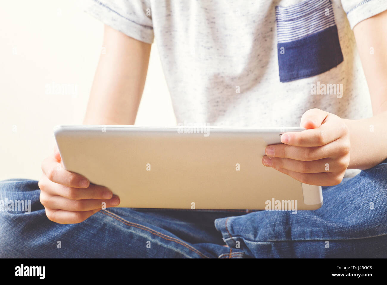 Kids hands with tablet computer Stock Photo - Alamy