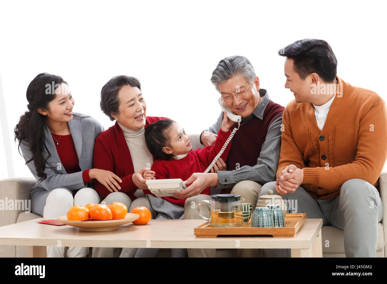 Happy family phone pay New Year's call Stock Photo - Alamy