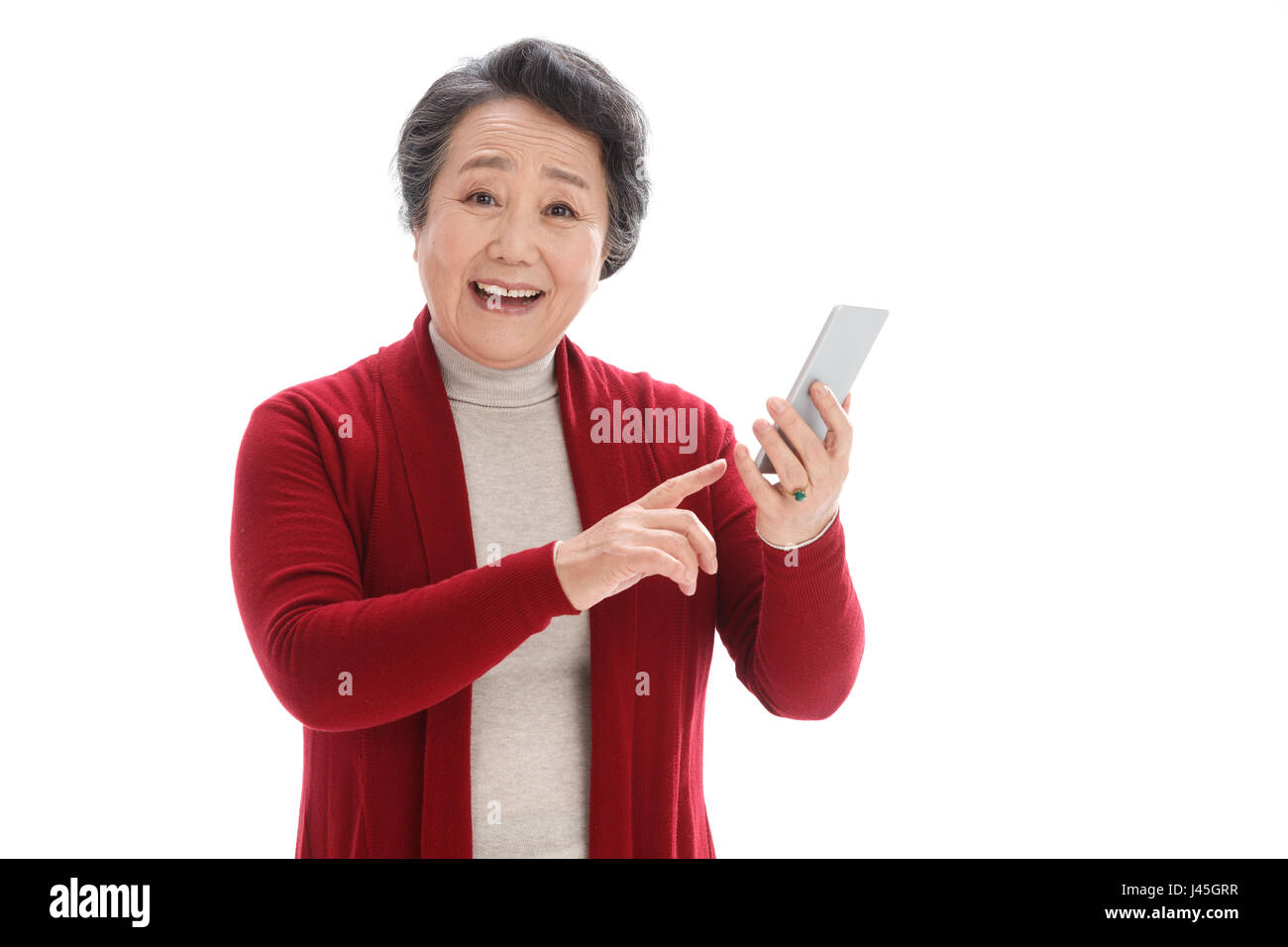 Old woman holding a cell phone Stock Photo - Alamy
