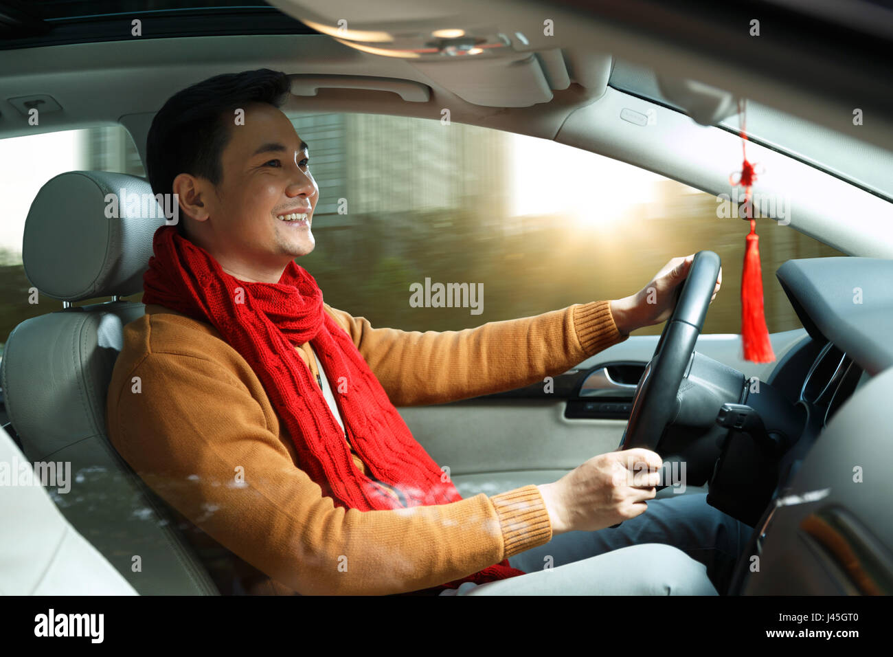 Young chinese man driving car hi-res stock photography and images - Alamy